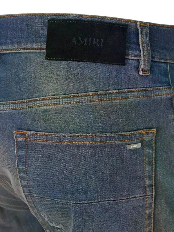 Amiri Distressed Ribbed-panel Jeans