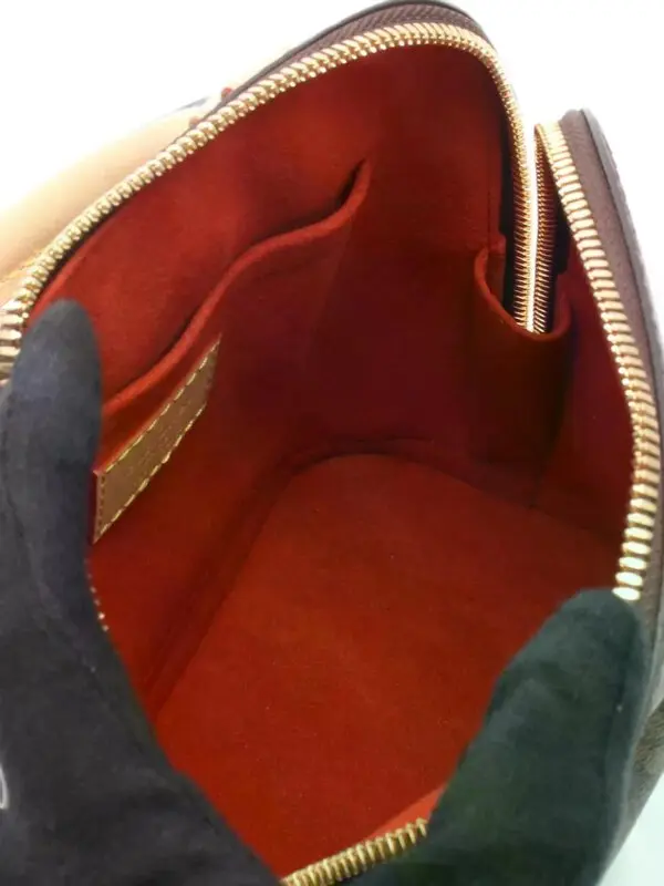 LOUIS VUITTON Alma Monogram Backpack
