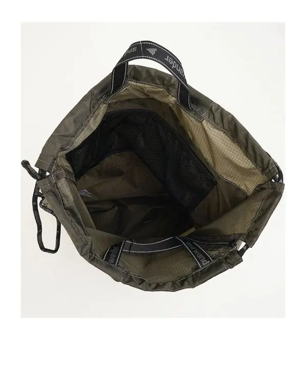 AND WANDER Drawstring Tote Bag