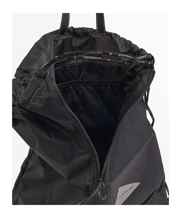 AND WANDER Drawstring Tote Bag