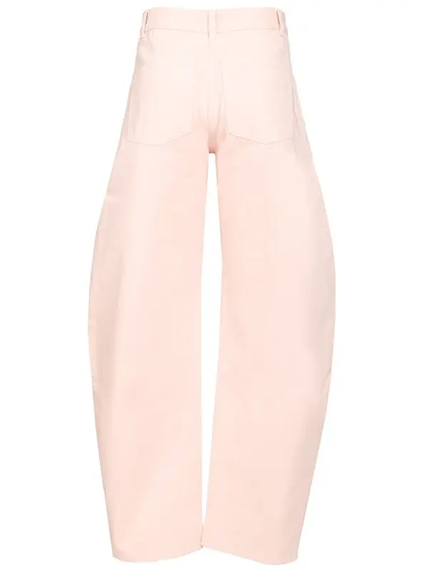 Alaïa Curved Dyed Denim Jeans