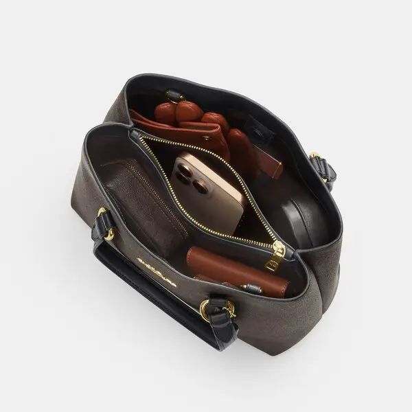 COACH OUTLET Station Carryall Bag In Signature Canvas - Gold/walnut/black