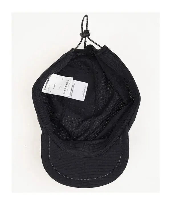 AND WANDER Logo Details On The Ventilated Hat