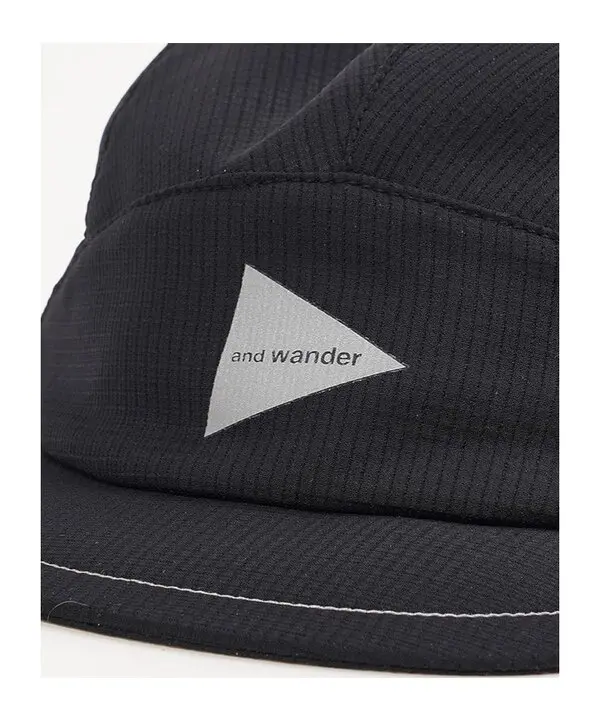 AND WANDER Logo Details On The Ventilated Hat