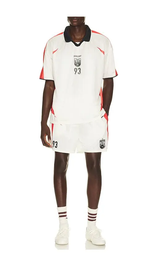 REPRESENT Spike Football Top In White