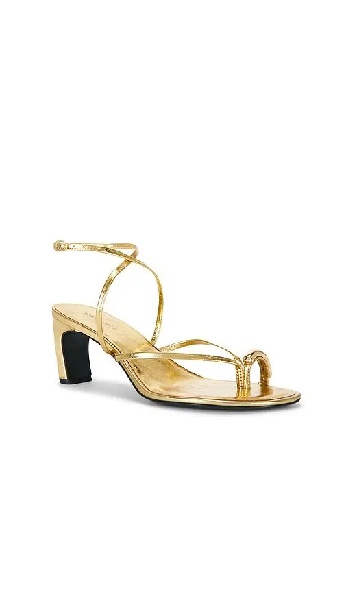 Tory Burch Pierced Strappy Heel Sandal In Metallic Gold