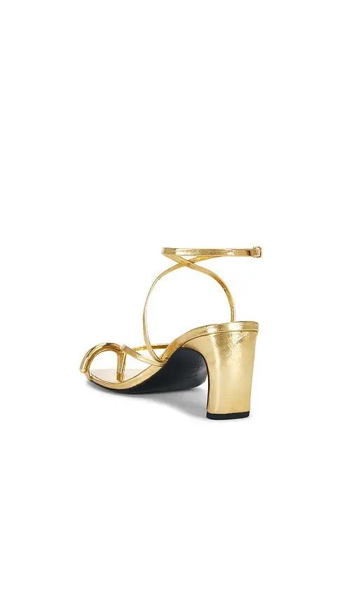 Tory Burch Pierced Strappy Heel Sandal In Metallic Gold