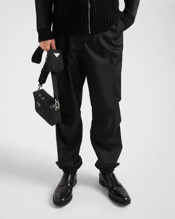 Prada Triangle-logo Mid-rise Tapered-leg Trousers
