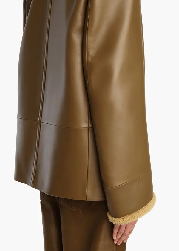 Khaite Marlotte Double-breasted Lambskin Coat With Shearling Trim