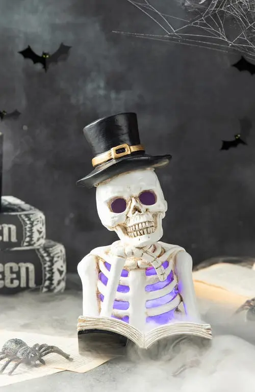 GLITZHOME 10.25"h Halloween Lighted Resin Skull Reading Book Table Decor