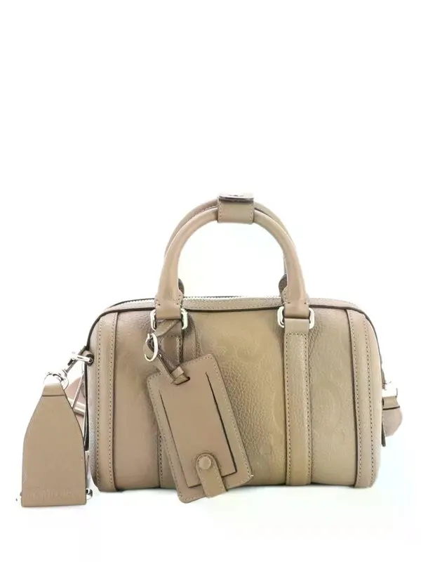 Gucci Jumbo Gg Embossed Leather Mini Travel Bag - Brown