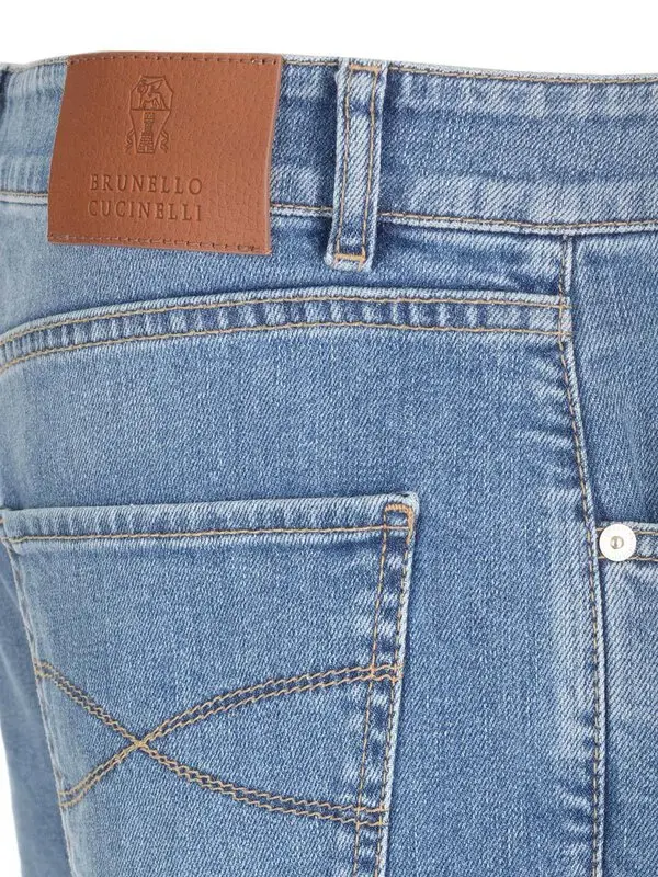 Brunello Cucinelli Tapered Leg Jeans With Logo Patch - Blue