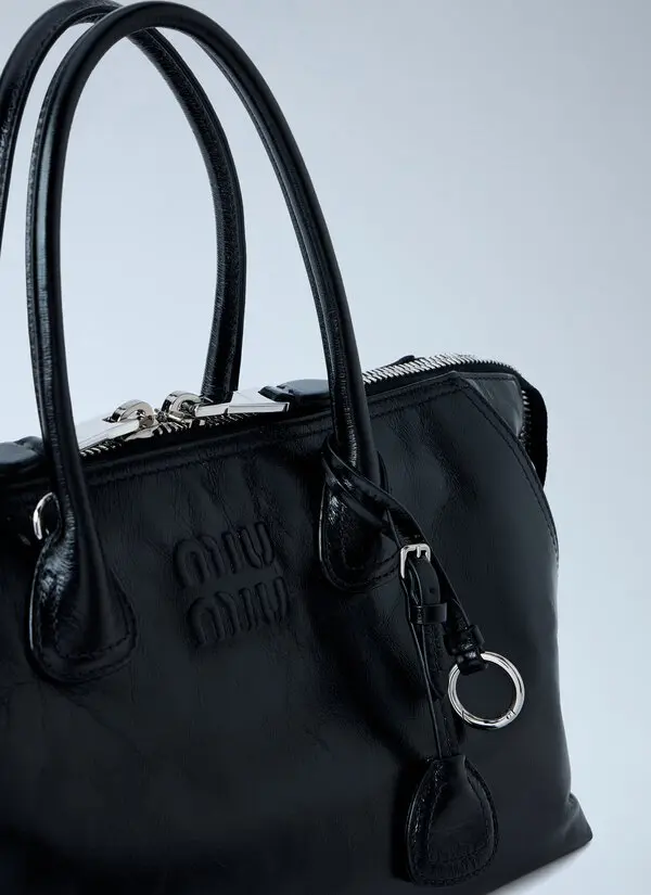 Miu Miu Patent Leather Top Handle Bag With Embossed Detailing - Black