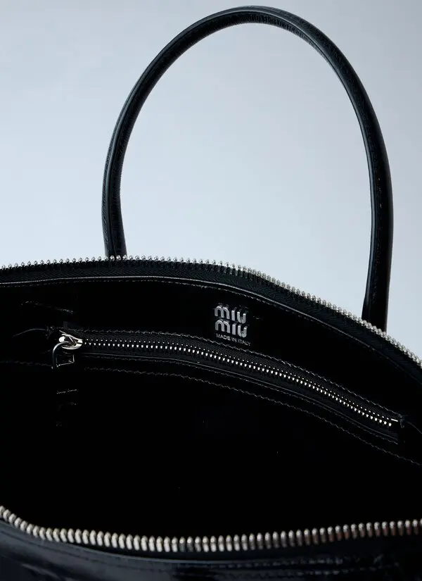 Miu Miu Patent Leather Top Handle Bag With Embossed Detailing - Black