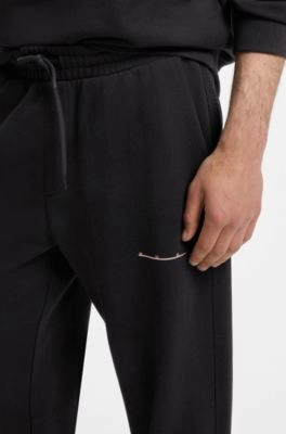Hugo Relaxed-fit Cotton Jogger Pants With Streetwear Logo