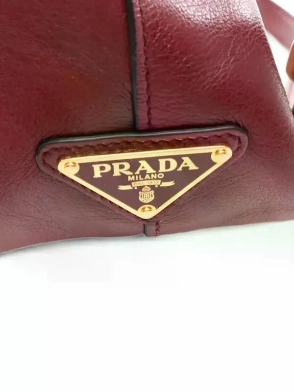 Prada 2000s Logo-embossed Leather Handbag
