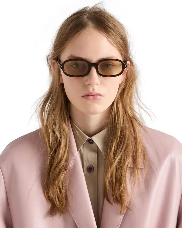 Prada Sunglasses With The Iconic Metal Plaque
