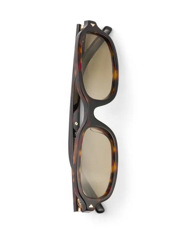 Prada Sunglasses With The Iconic Metal Plaque
