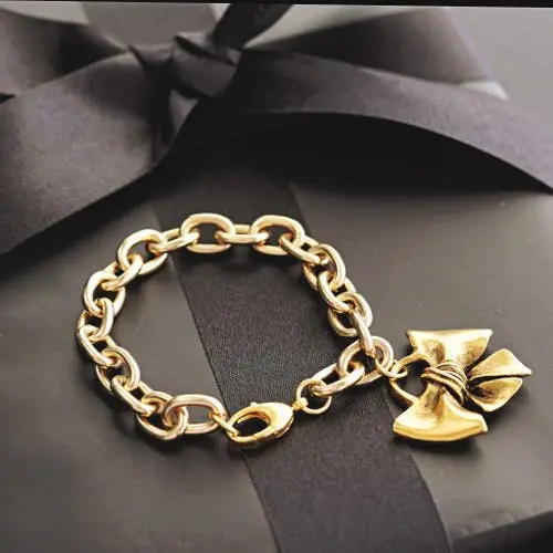 BOWOOD LANE 12k Plated Oval Link Chain Bow Charm Bracelet