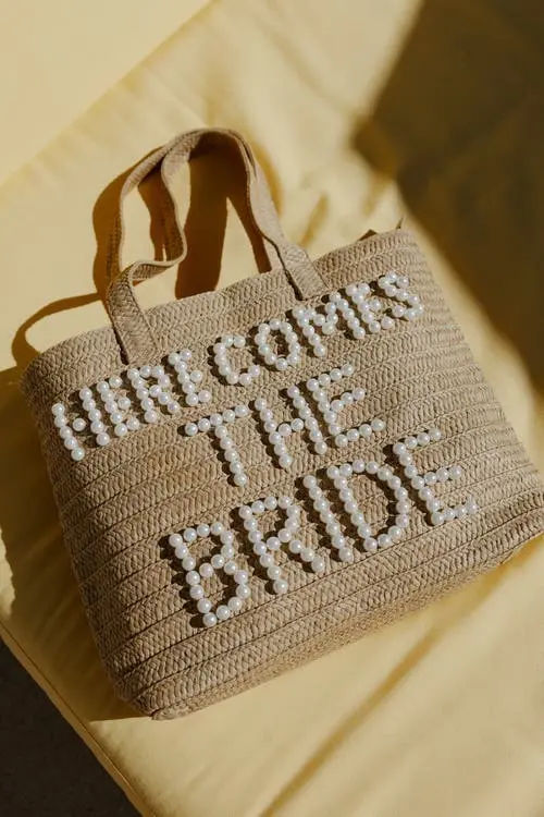 UNTAMED PETALS Here Comes The Bride" Pearl Embellished Straw Tote
