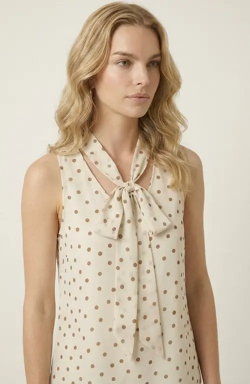 MODENAIRE Sleeveless Tie Neck Polka Dot Blouse