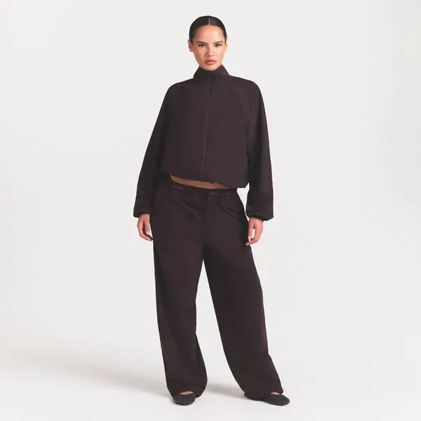 SKIMS Oversized Stretch Nylon Pants - Dark Roast