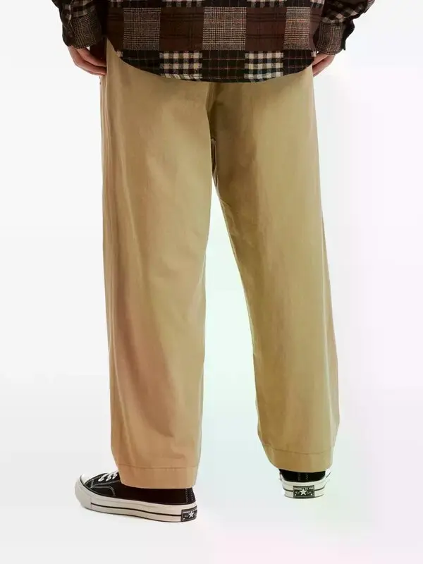 FINGERCROXX Logo-patch Pleat-detail Trousers