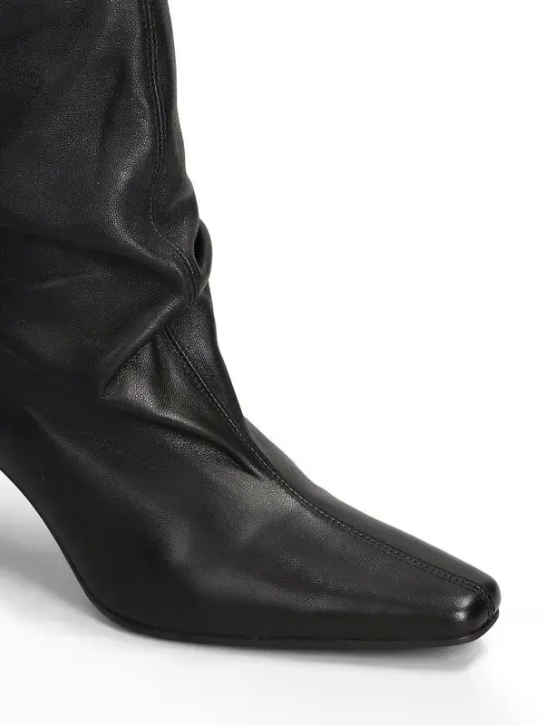 THE SELLER Slouchy Pointed-toe Leather Ankle Boots - Black