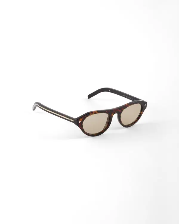 Prada Sunglasses With The Iconic Metal Plaque