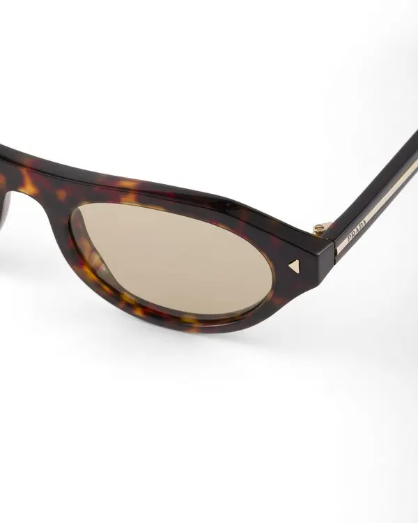 Prada Sunglasses With The Iconic Metal Plaque