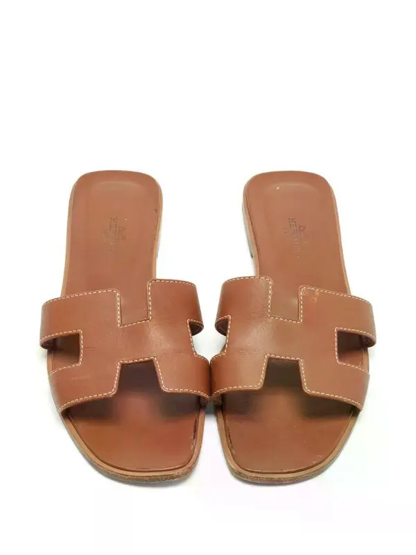 Hermès Oran Cutout Leather Slides - Brown