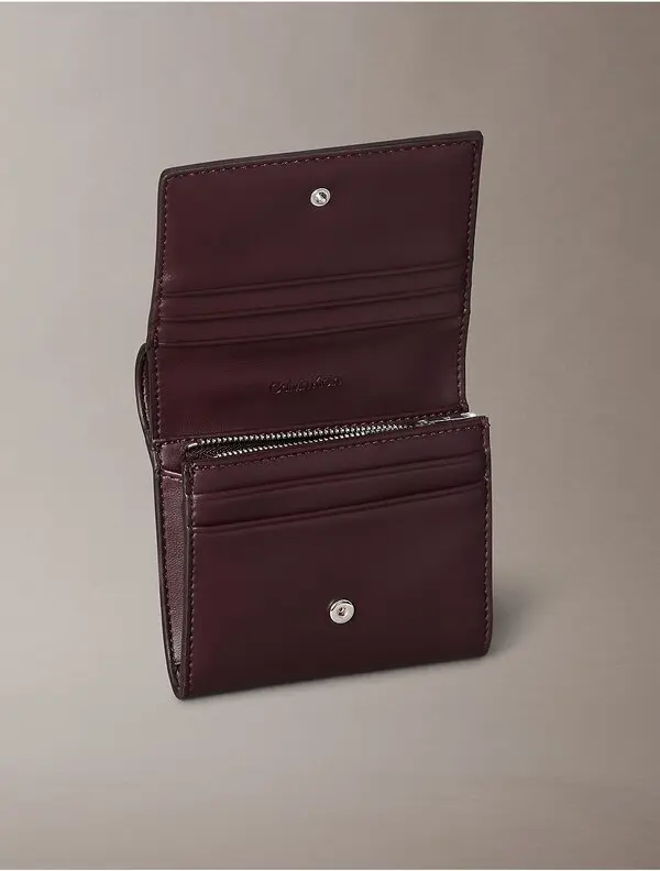 Calvin Klein Embossed Monogram Bifold Wallet - Fudge