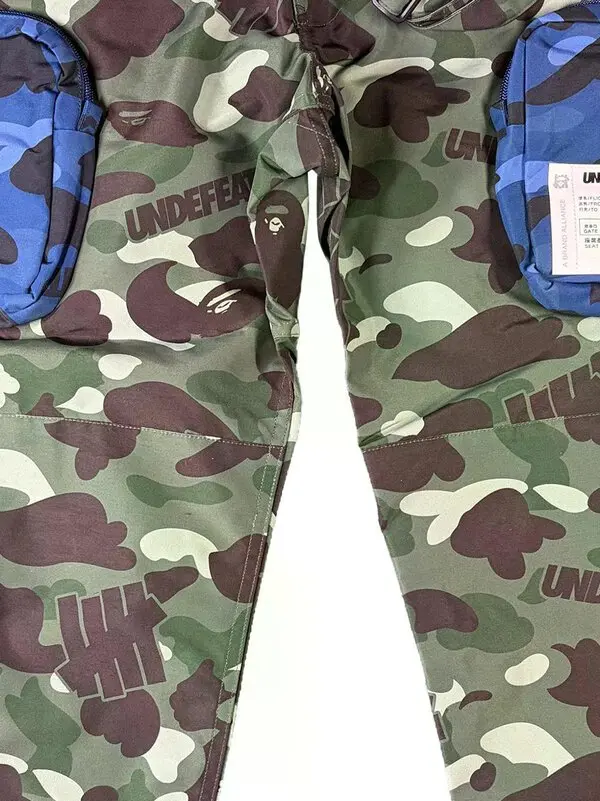 A BATHING APE X Undefeated Multi-pouch Camo Cargo Pants