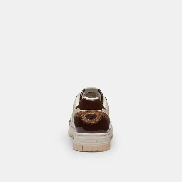 COACH OUTLET Soho Sneaker With Patent Signature - Brown/maple