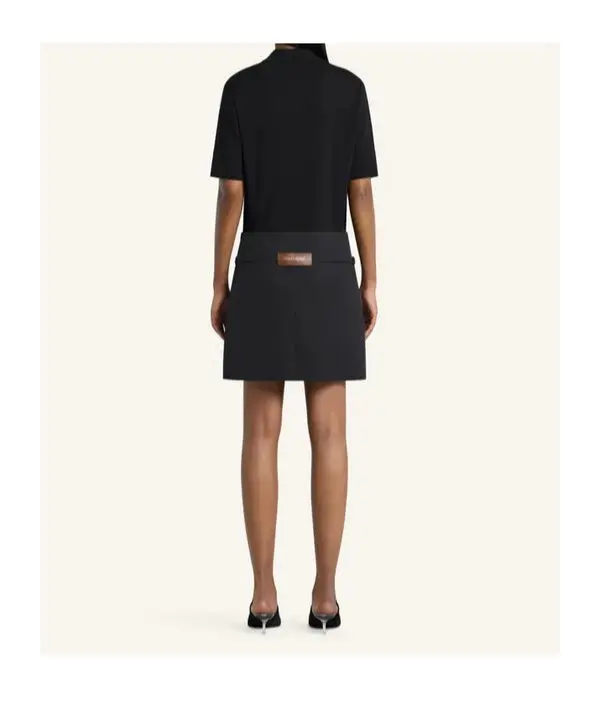 COURREGES Short-sleeved Merino Wool Polo With Embroidered Logo - Black