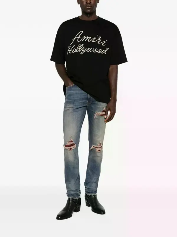 Amiri Distressed Patchwork Jeans