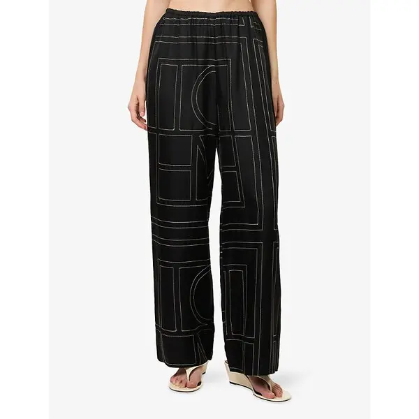 TOTEME Monogram-print Silk-twill Pyjama Bottoms - Black