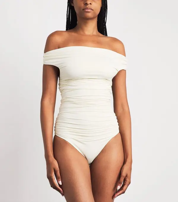 MORE NOIR Nadia Off-the-shoulder Ruched One-piece Swimsuit