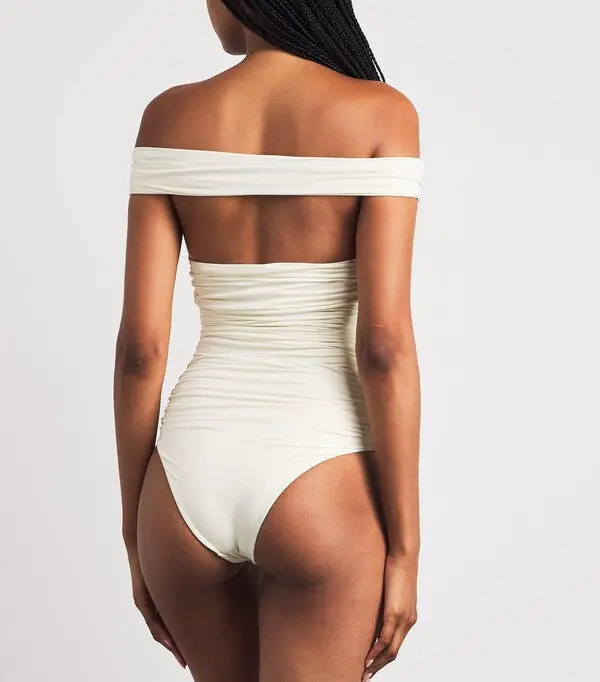 MORE NOIR Nadia Off-the-shoulder Ruched One-piece Swimsuit