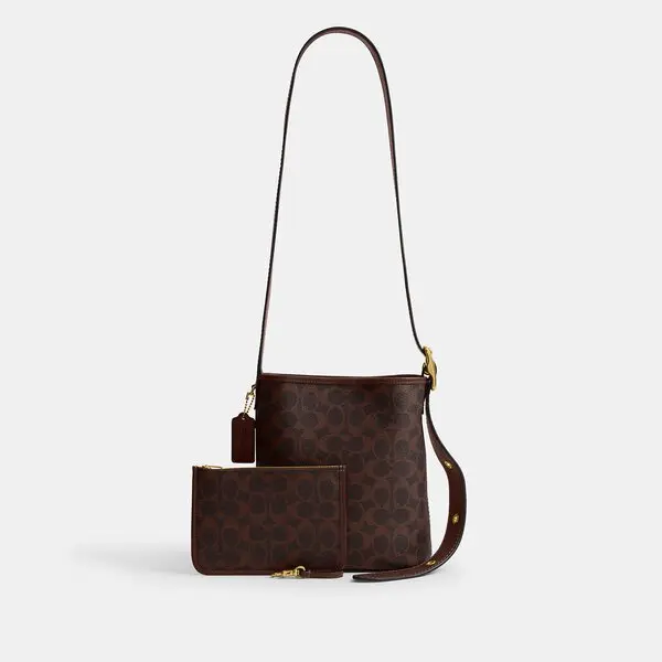 COACH OUTLET Coach Signature Canvas Bleecker Bucket Bag 21