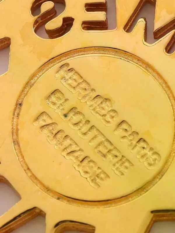 Hermès Tone Cut-out Logo Pendant