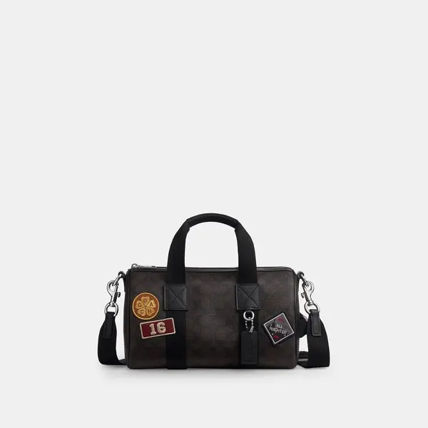 COACH OUTLET Explorer Duffle Bag 28 In Signature Canvas With Patches - Silver/walnut/black