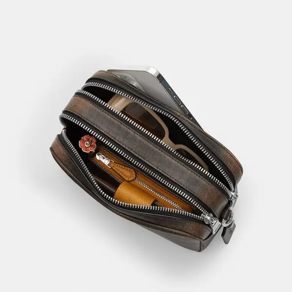COACH OUTLET Mini Carey Crossbody Bag In Loved Leather - Silver/black Brown