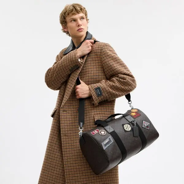 COACH OUTLET Explorer Duffle Bag 45 In Signature Canvas With Patches