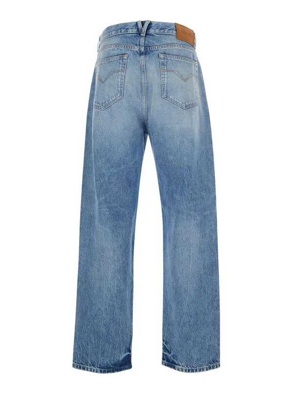 Versace Light Blue Jeans With Logo Patch On The Back And Faded Effect In Denim For