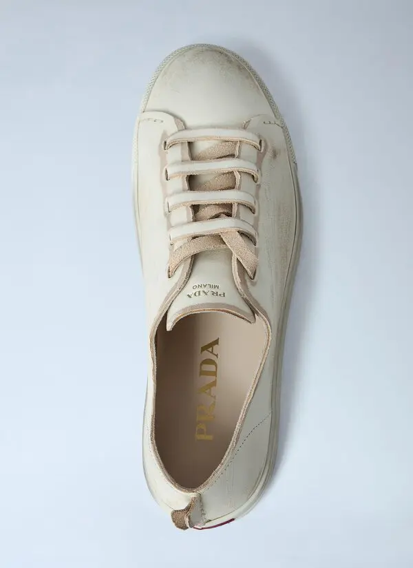 Prada Antiqued Leather Sneakers - White