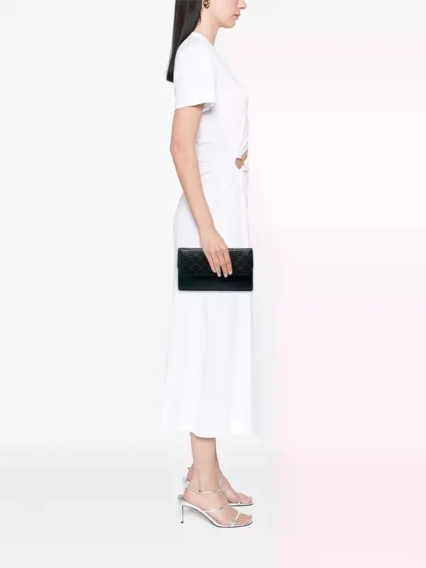 Gucci Monogram Embossed Leather Clutch