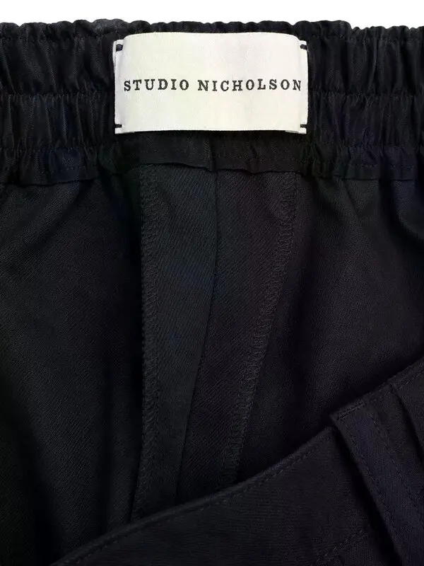 Studio Nicholson Shires Pleated Elasticated-waist Trousers