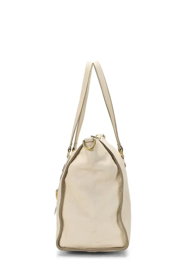 LOUIS VUITTON Neige Monogram Empreinte Lumineuse - White