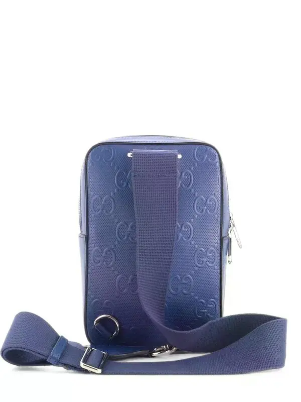 Gucci Gg Embossed Perforated Leather Sling Backpack - Blue